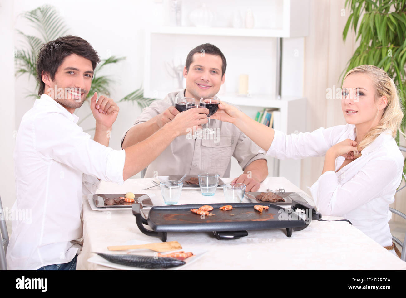 Friends having dinner at home Stock Photo - Alamy