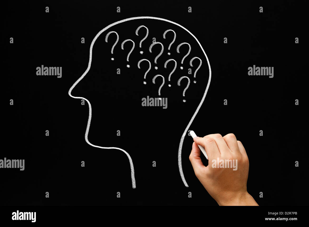 Hand drawing Human head and many question marks with white chalk on ...