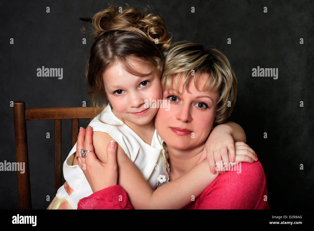 Portrait mum with a daughter in studio Stock Photo - Alamy