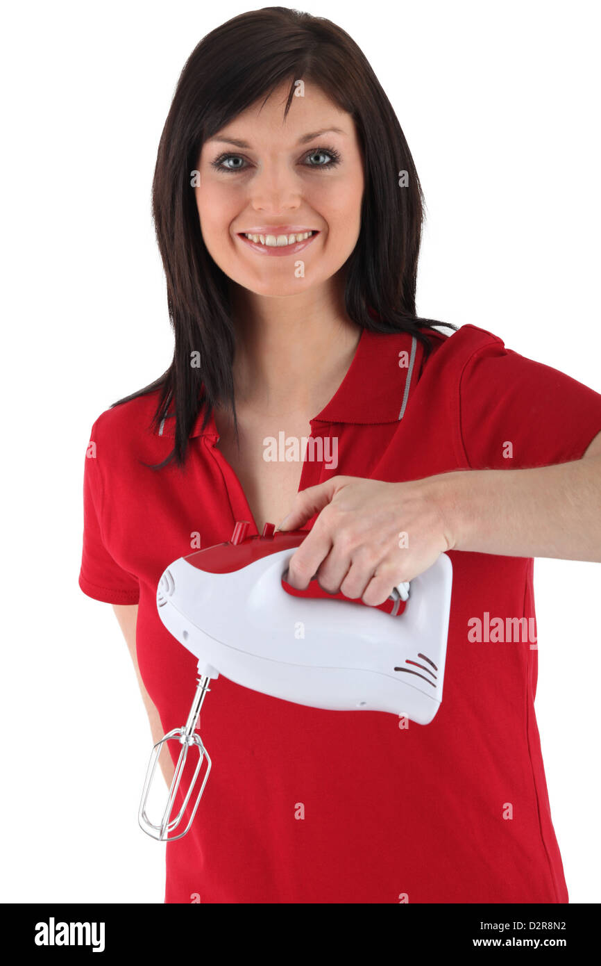 Woman with an electric whisk Stock Photo - Alamy
