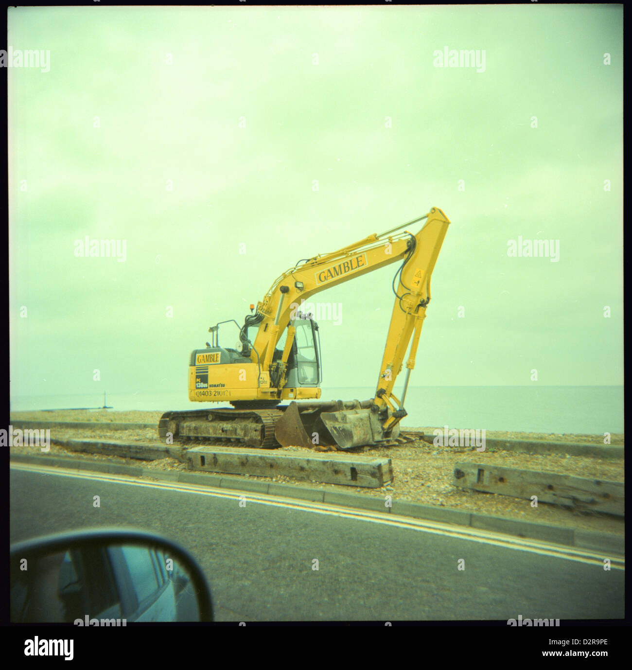 Digger on Beach Stock Photo - Alamy