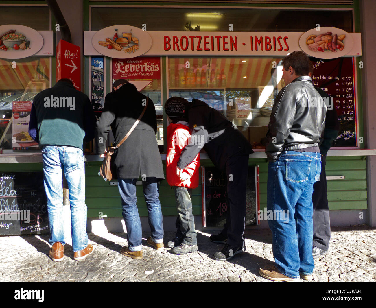 Germany Munich Viktualienmarkt open market. People queue up to buy ...