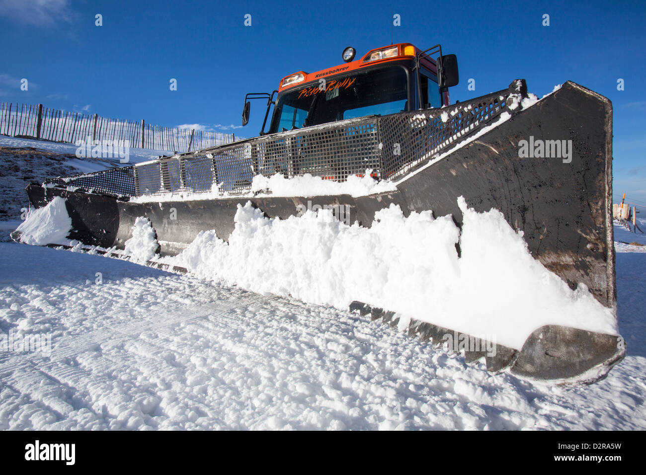 A piste basher on a ski run in the Cairngorm mountains. climate change ...
