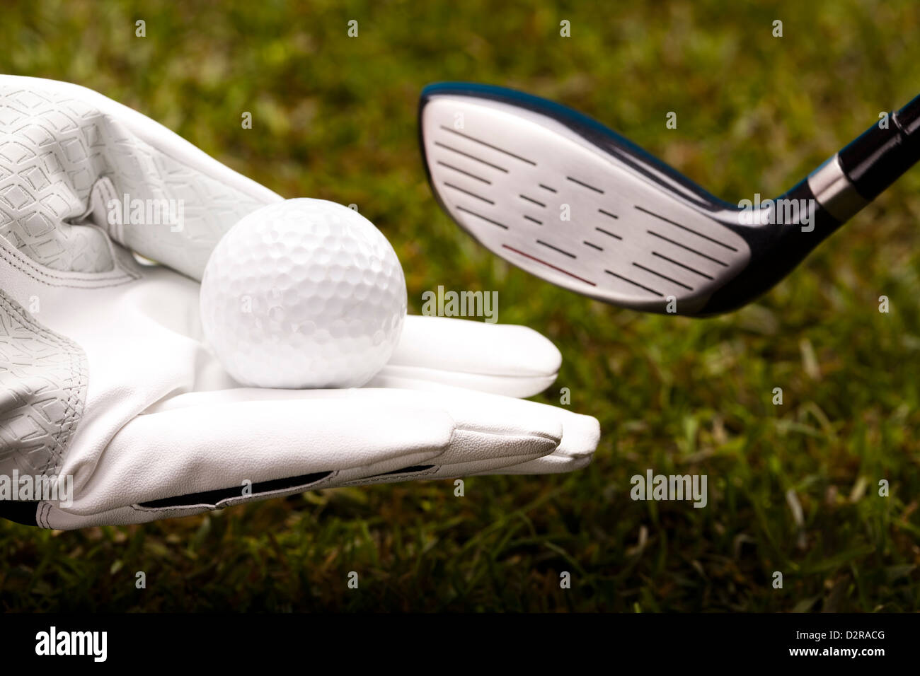 Hand and golf ball Stock Photo - Alamy