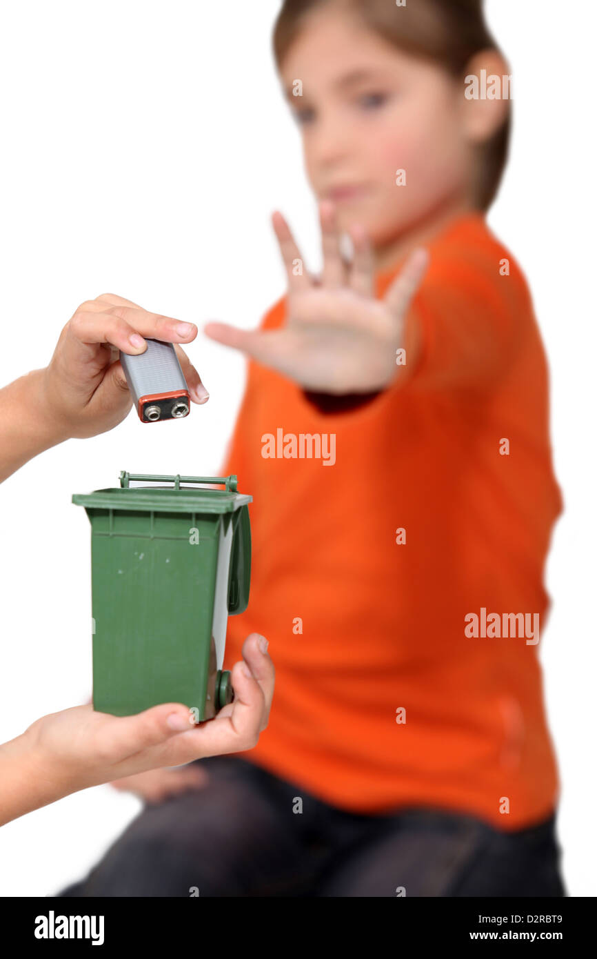 Kids illustrating improper disposal of batteries Stock Photo - Alamy