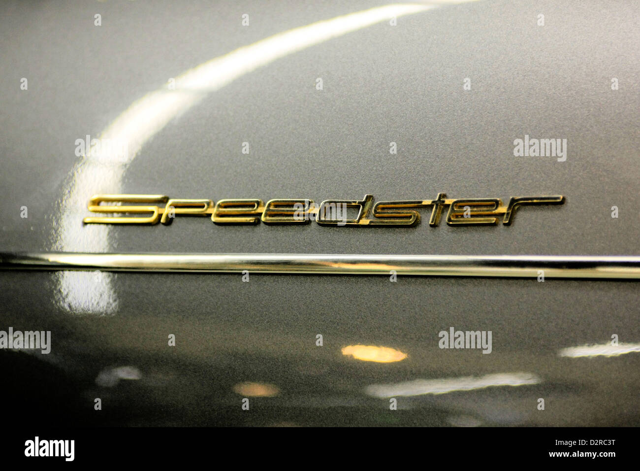 Porsche Speedster gold on chrome logo Stock Photo - Alamy