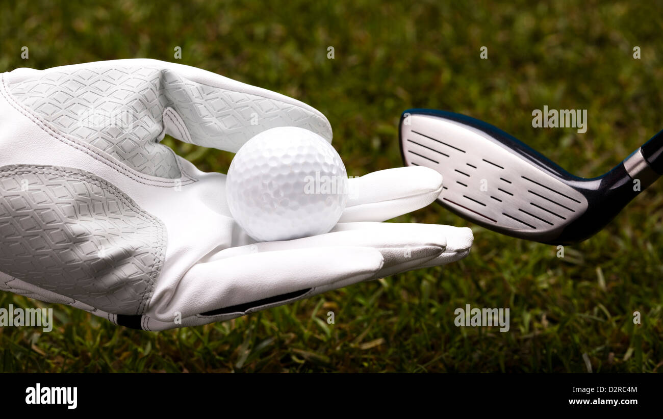 Hand and golf ball Stock Photo - Alamy