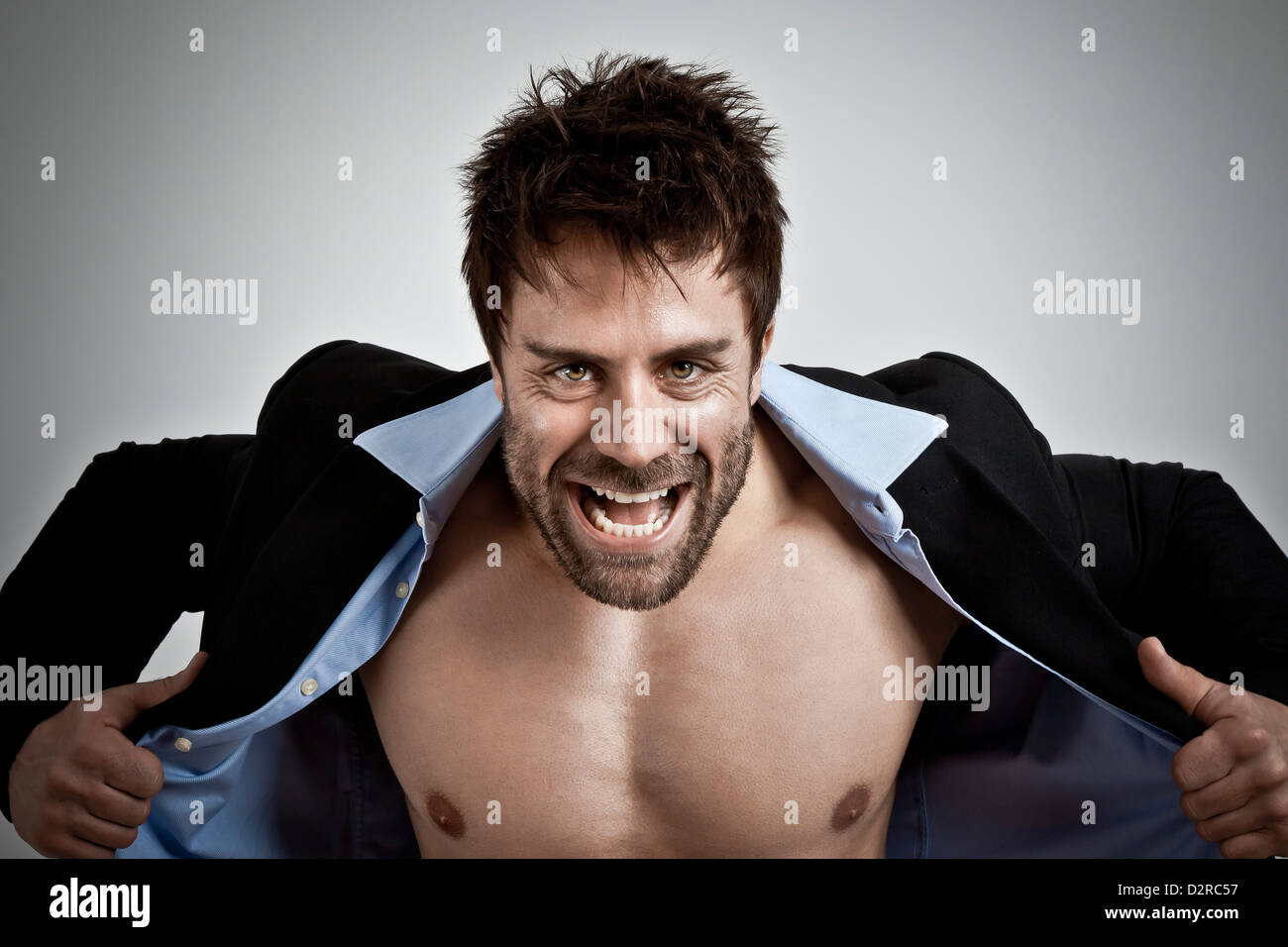 An image of a business man with muscles Stock Photo - Alamy