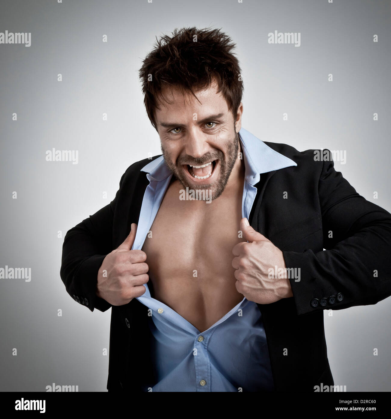 An image of a business man with muscles Stock Photo - Alamy