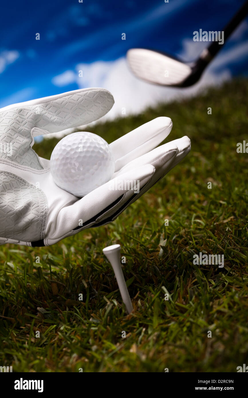 Hand and golf ball Stock Photo - Alamy