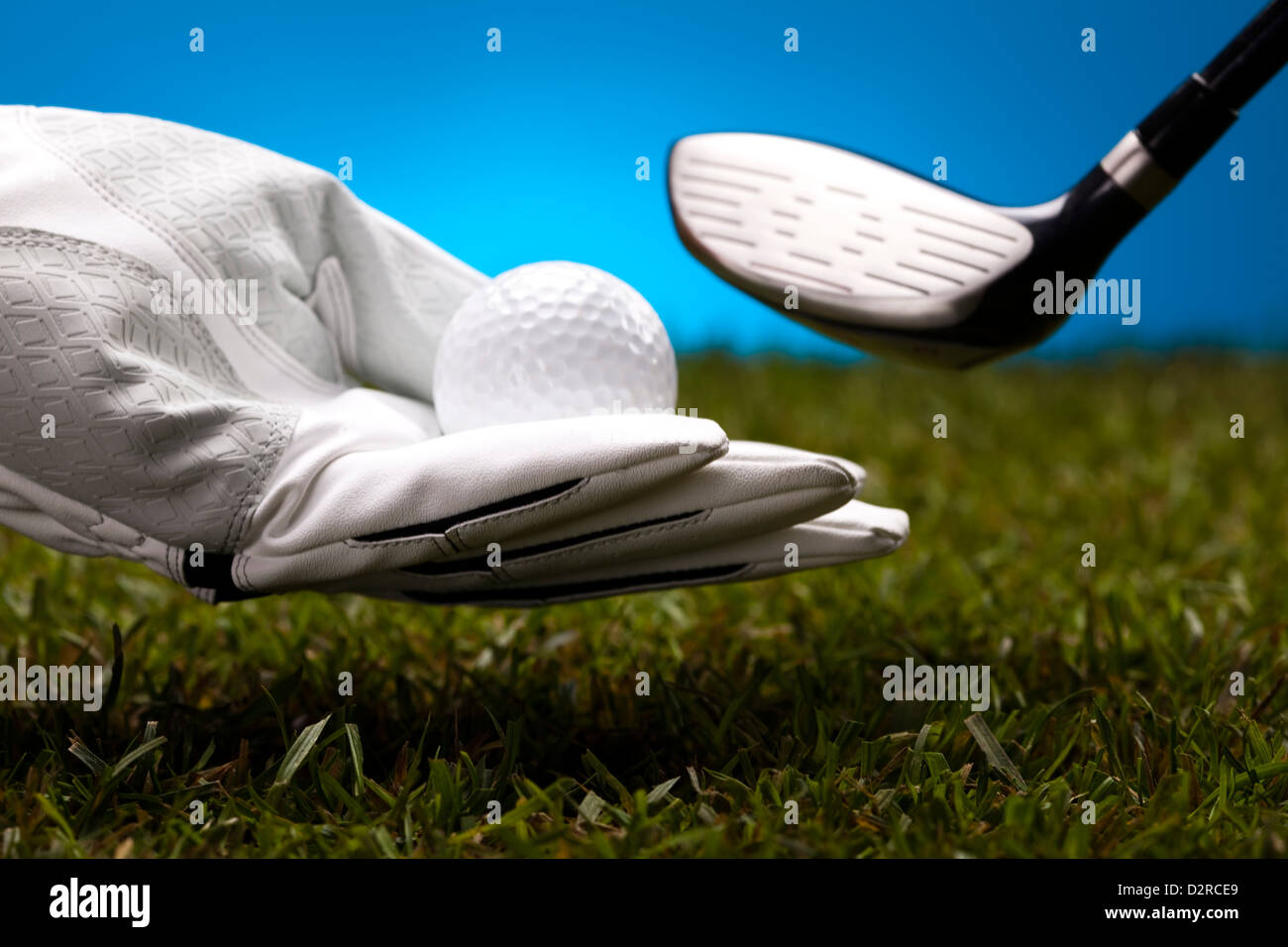 Hand and golf ball Stock Photo - Alamy