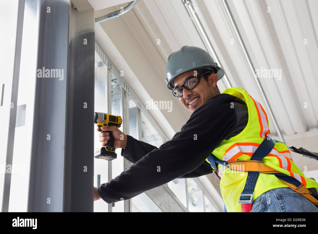 Hispanic man working at construction site Stock Photo - Alamy