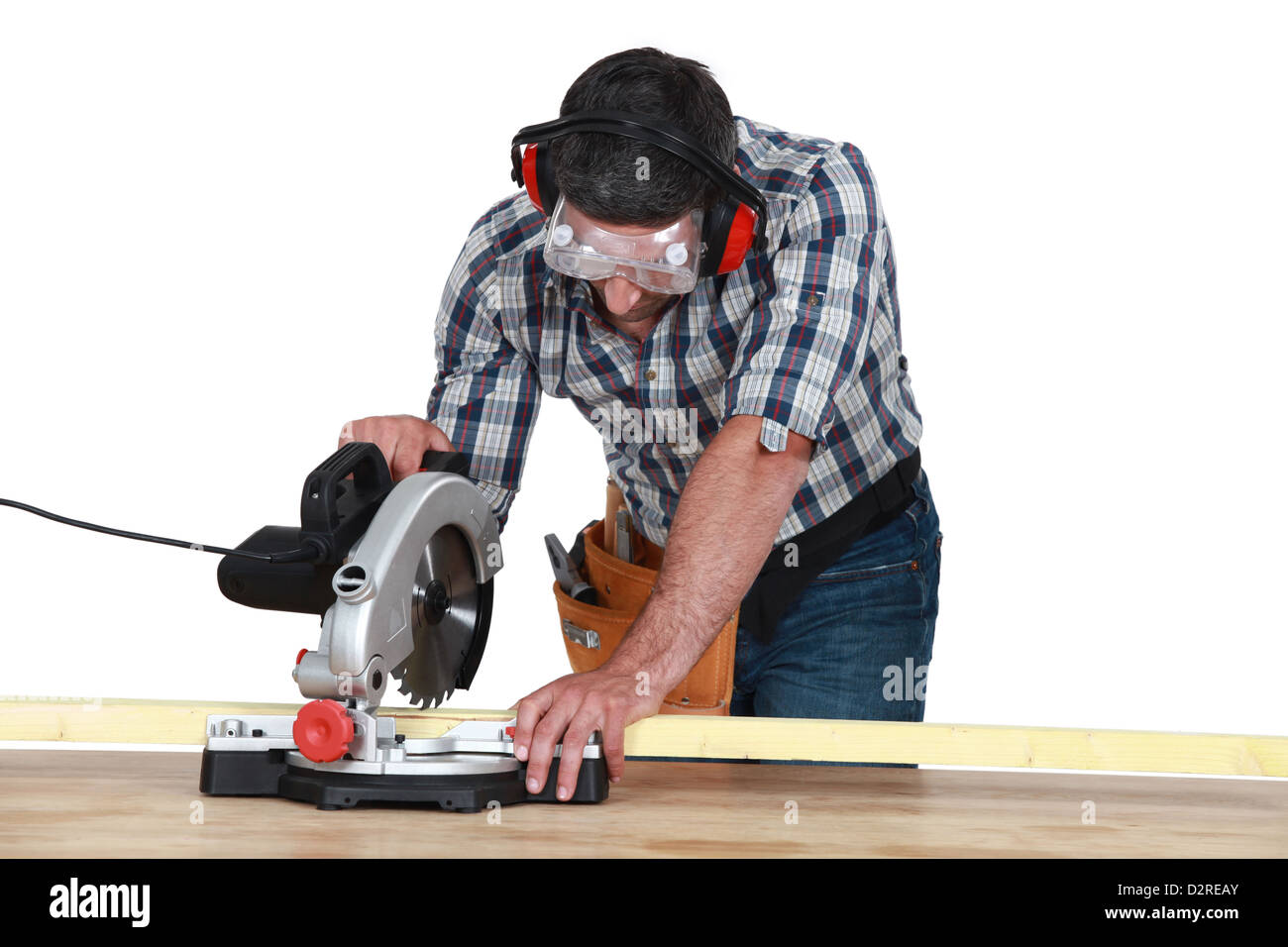 Carpenter with a saw Stock Photo - Alamy