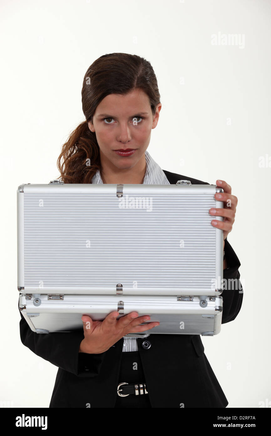 Woman opening metal briefcase Stock Photo - Alamy