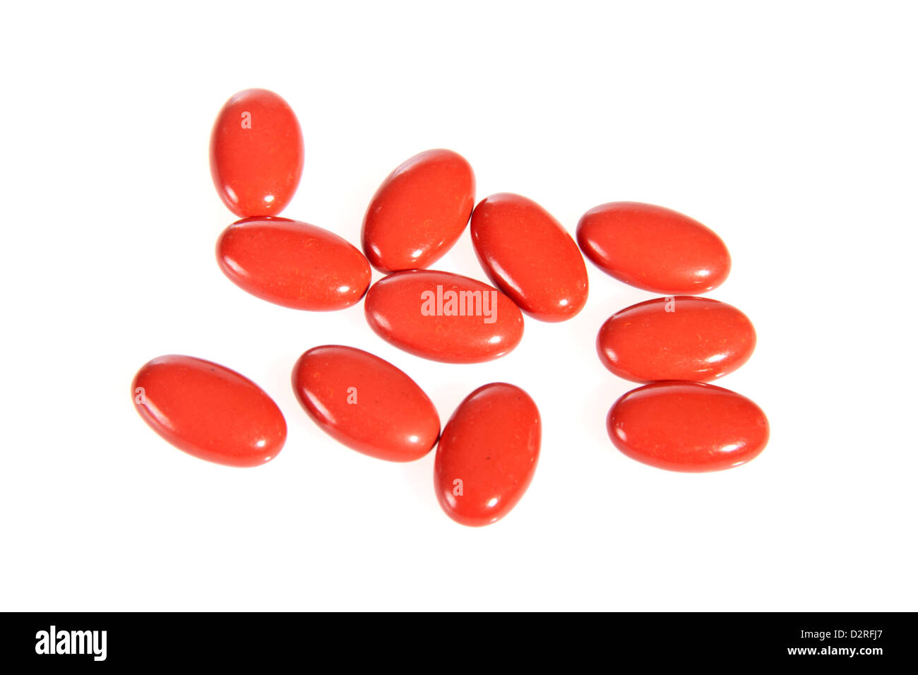 Red pills, isolated on white Stock Photo - Alamy