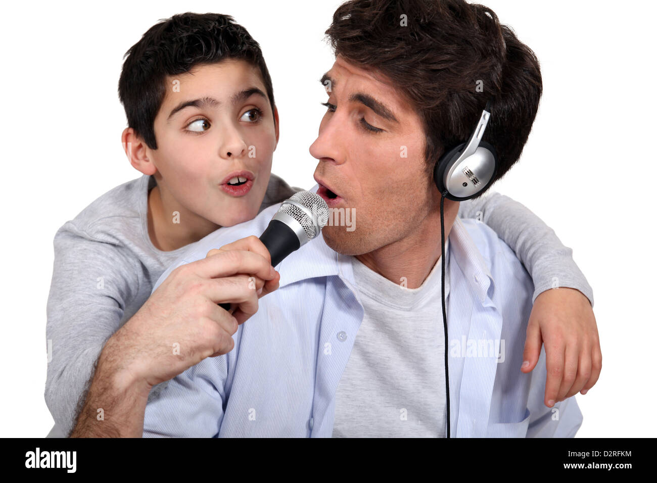 father and son listening music and singing Stock Photo - Alamy