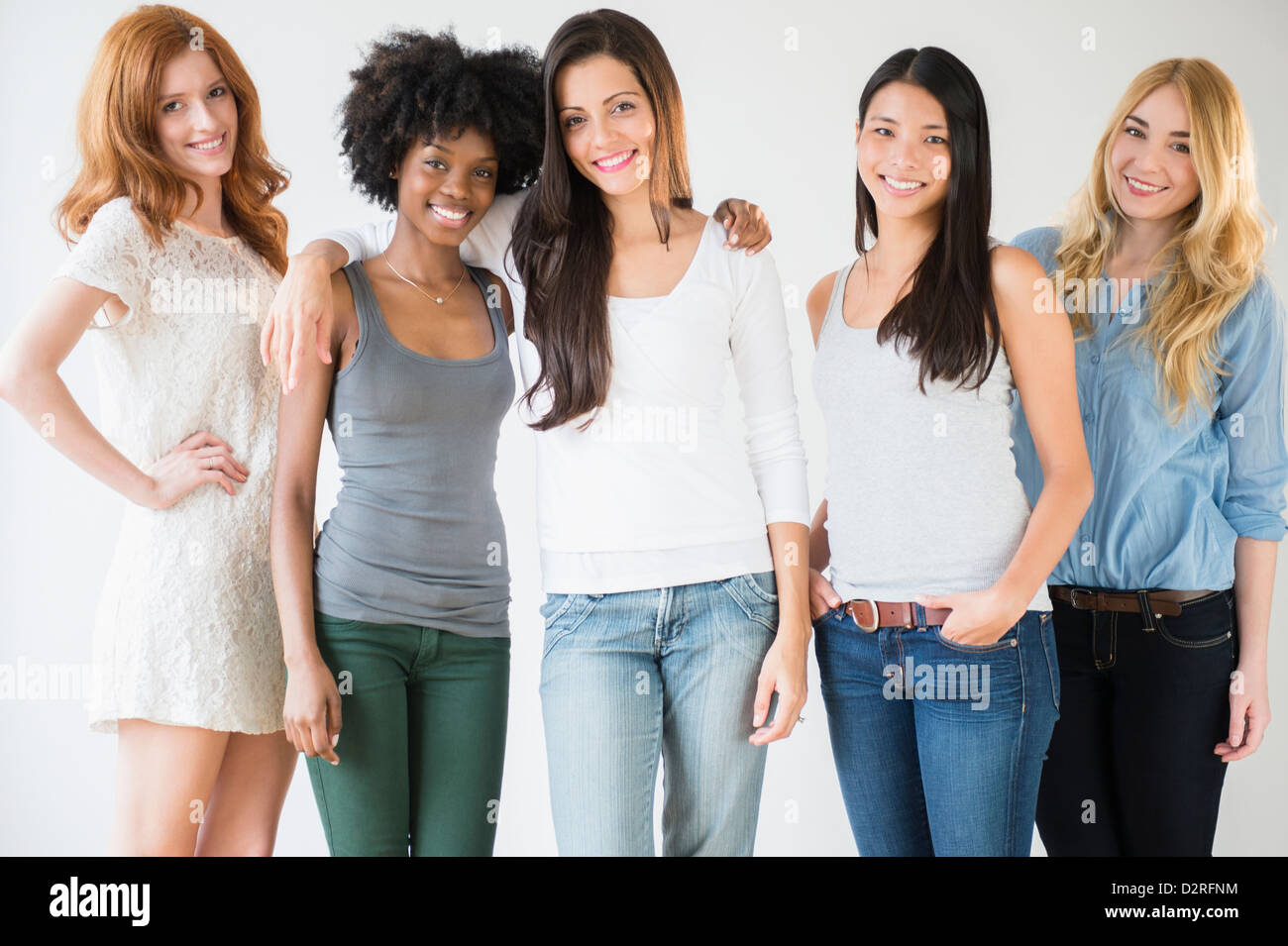 Smiling women standing together Stock Photo - Alamy