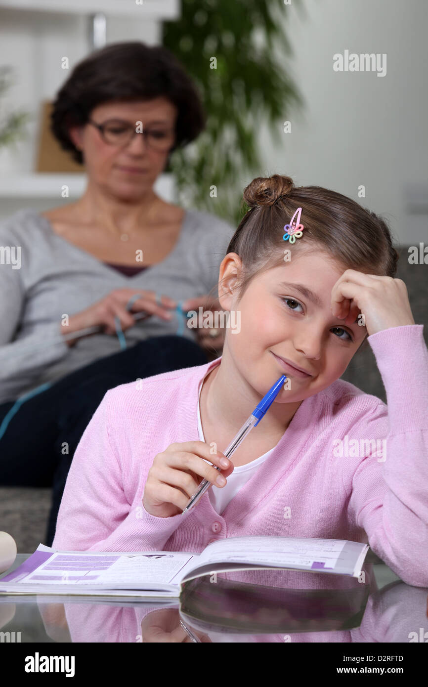 Little girl doing school work at home Stock Photo - Alamy