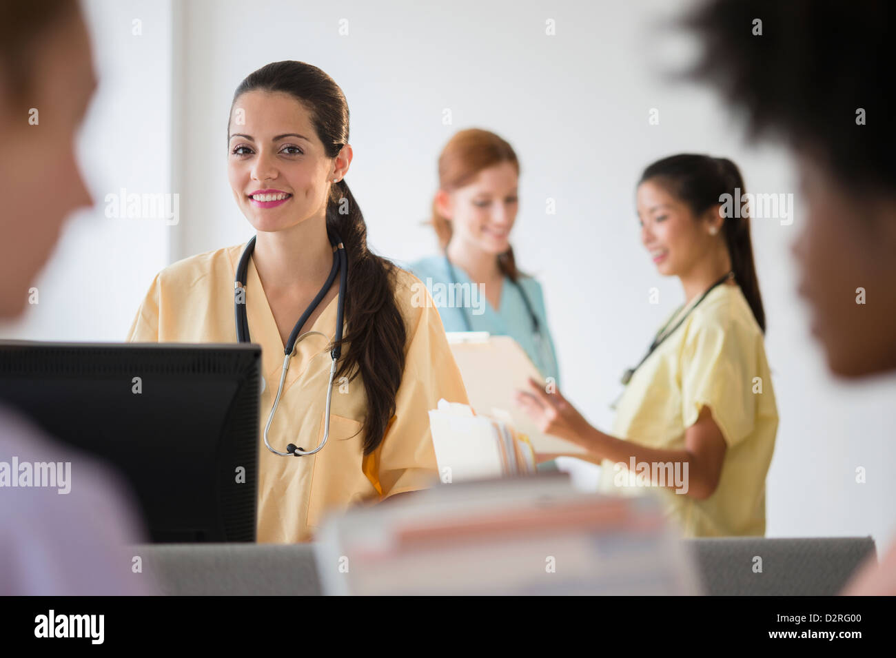 Nurses in colorful scrubs talking in hospital Stock Photo - Alamy