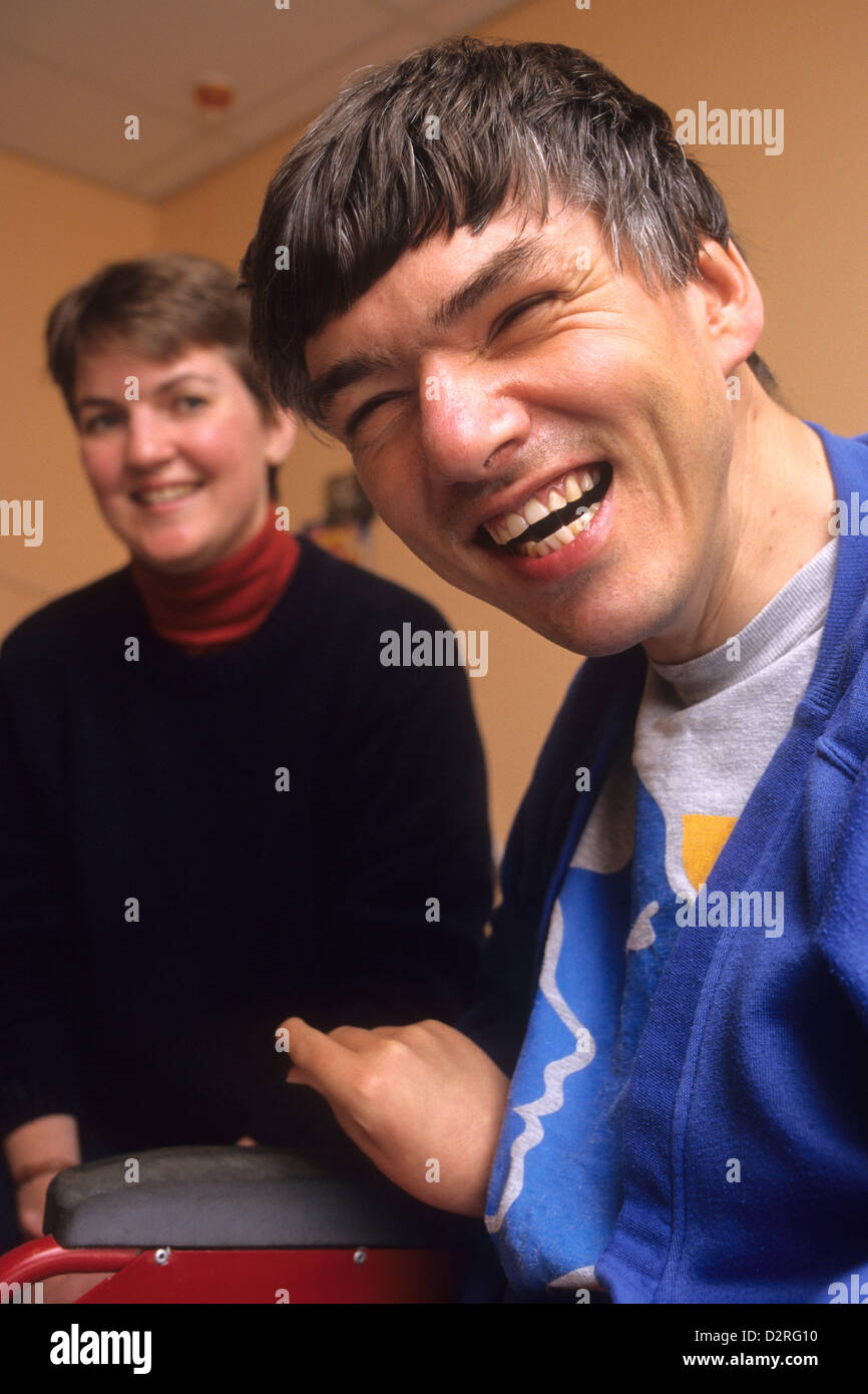 Portrait of young disabled man smiling and laughing Stock Photo - Alamy