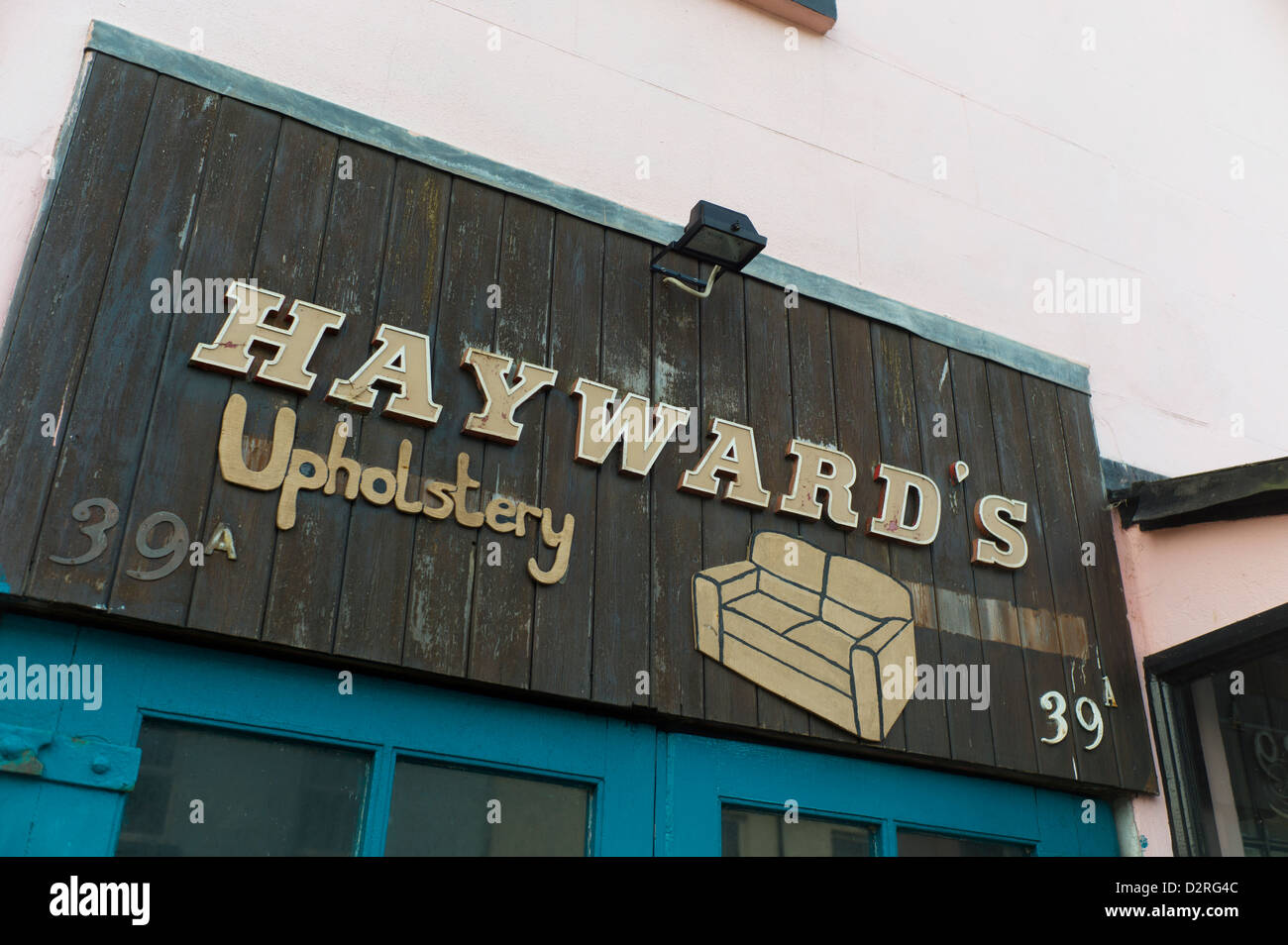 Old handmade business sign, upholstery Stock Photo - Alamy