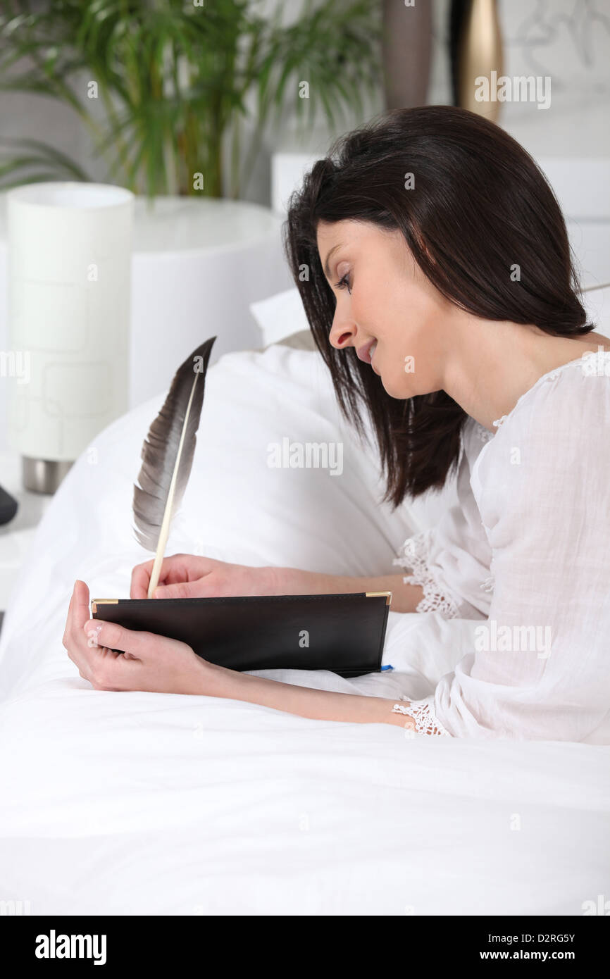 Female hand writing feather hi-res stock photography and images - Alamy