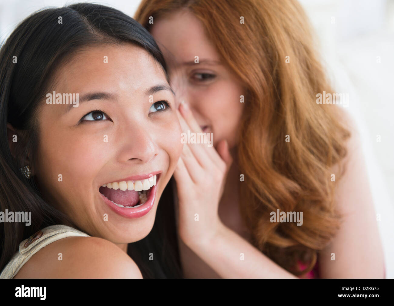 Whispering to each other hi-res stock photography and images - Alamy