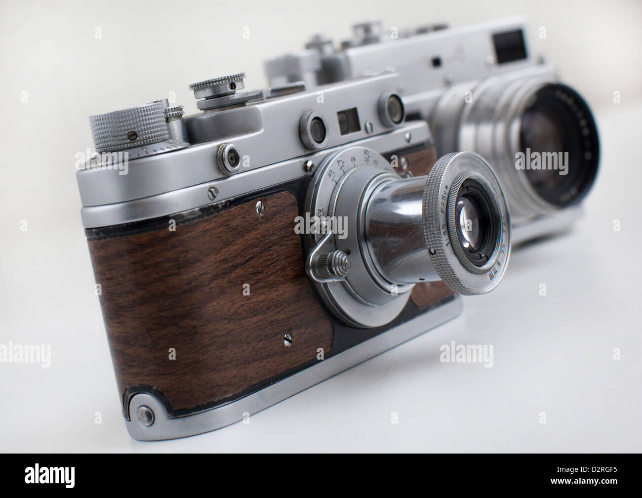 An antique old photo cameras on white background Stock Photo - Alamy