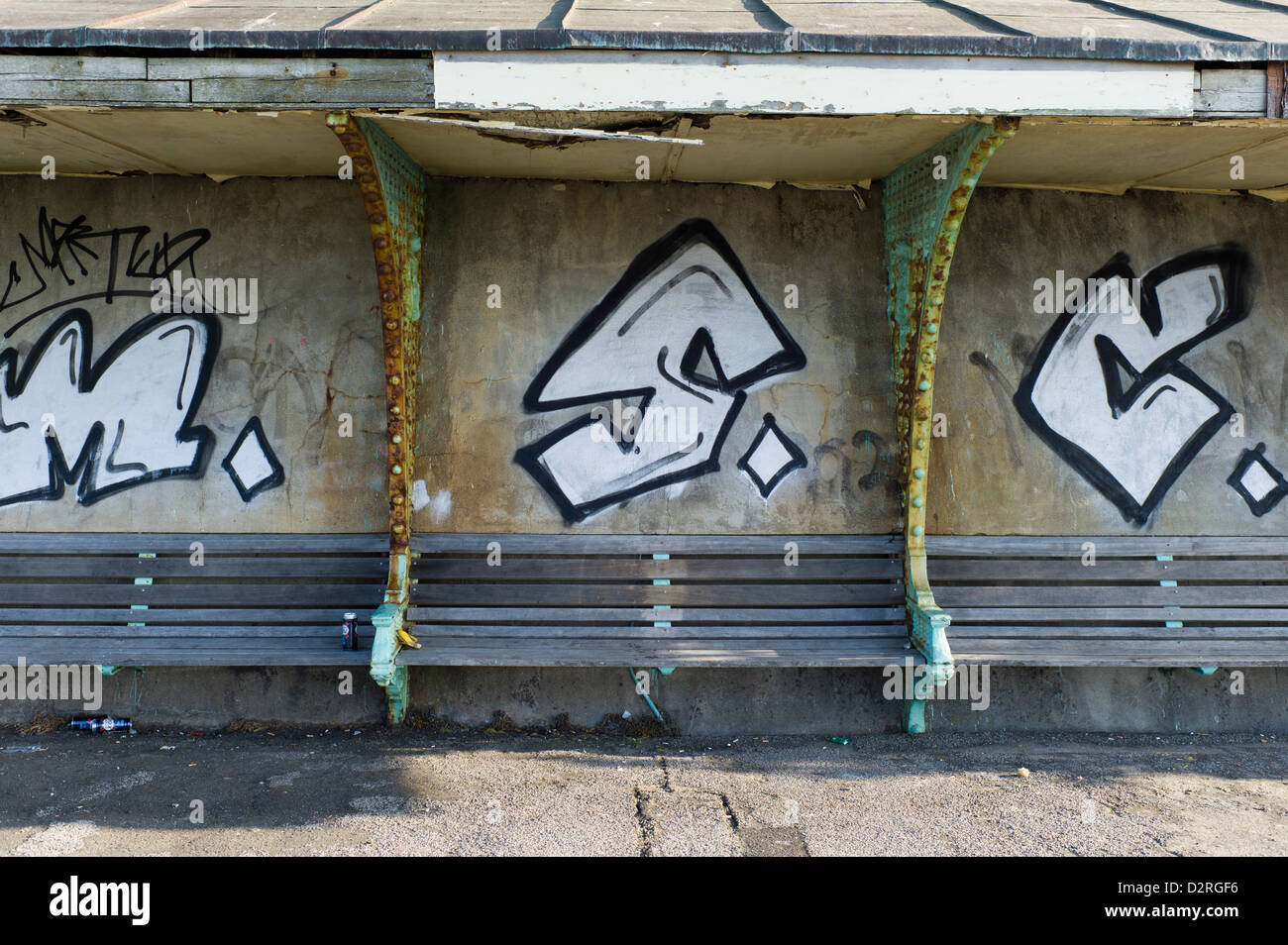 Derelict seaside shelter, benches, graffiti Stock Photo - Alamy