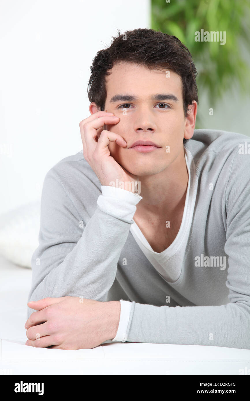 Bored young man at home Stock Photo - Alamy
