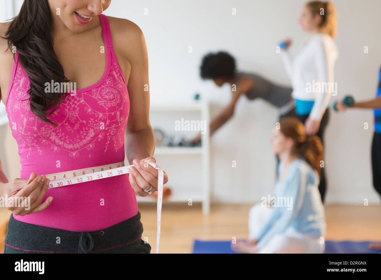 African american woman measuring waist hi-res stock photography and ...