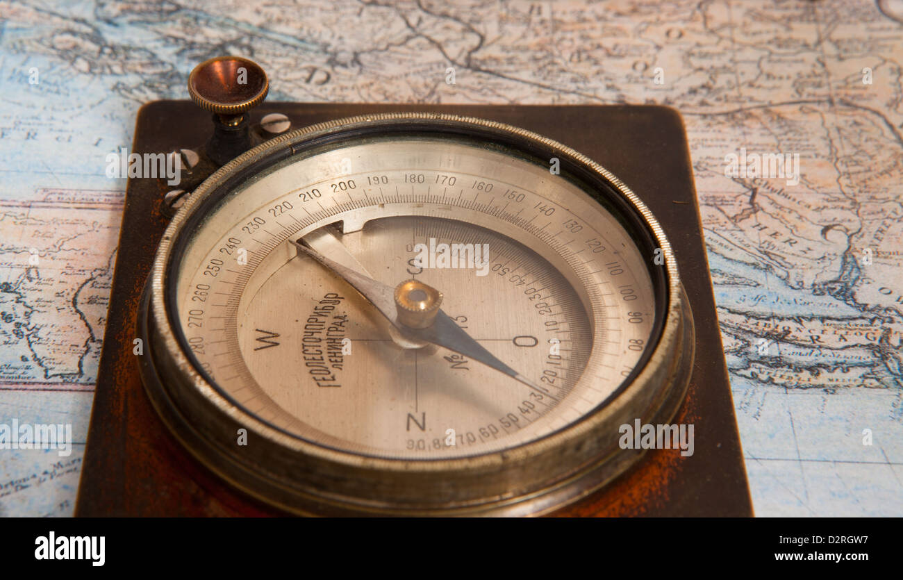 An old Russian compass with old map Stock Photo - Alamy