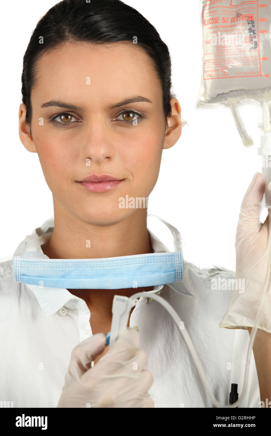 Nurse holding drip bag hi-res stock photography and images - Alamy