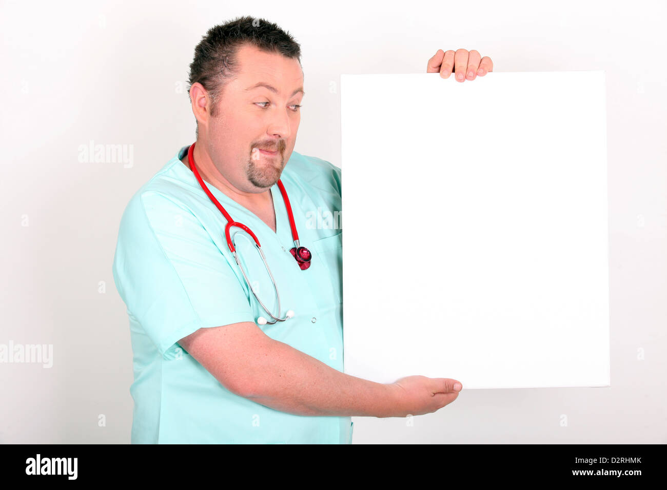 Doctor holding a blank sign Stock Photo - Alamy