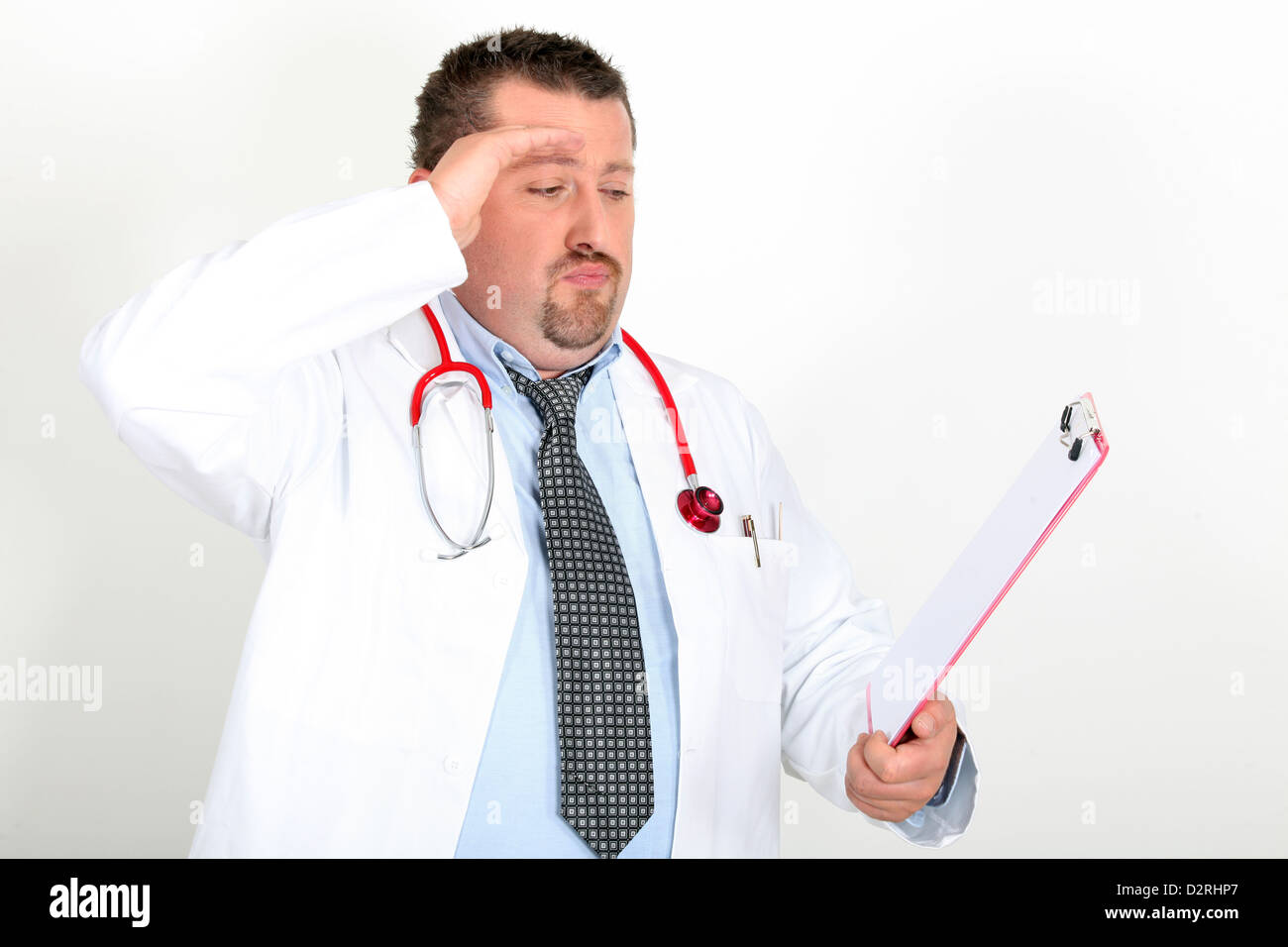 Male doctor saluting clipboard Stock Photo - Alamy