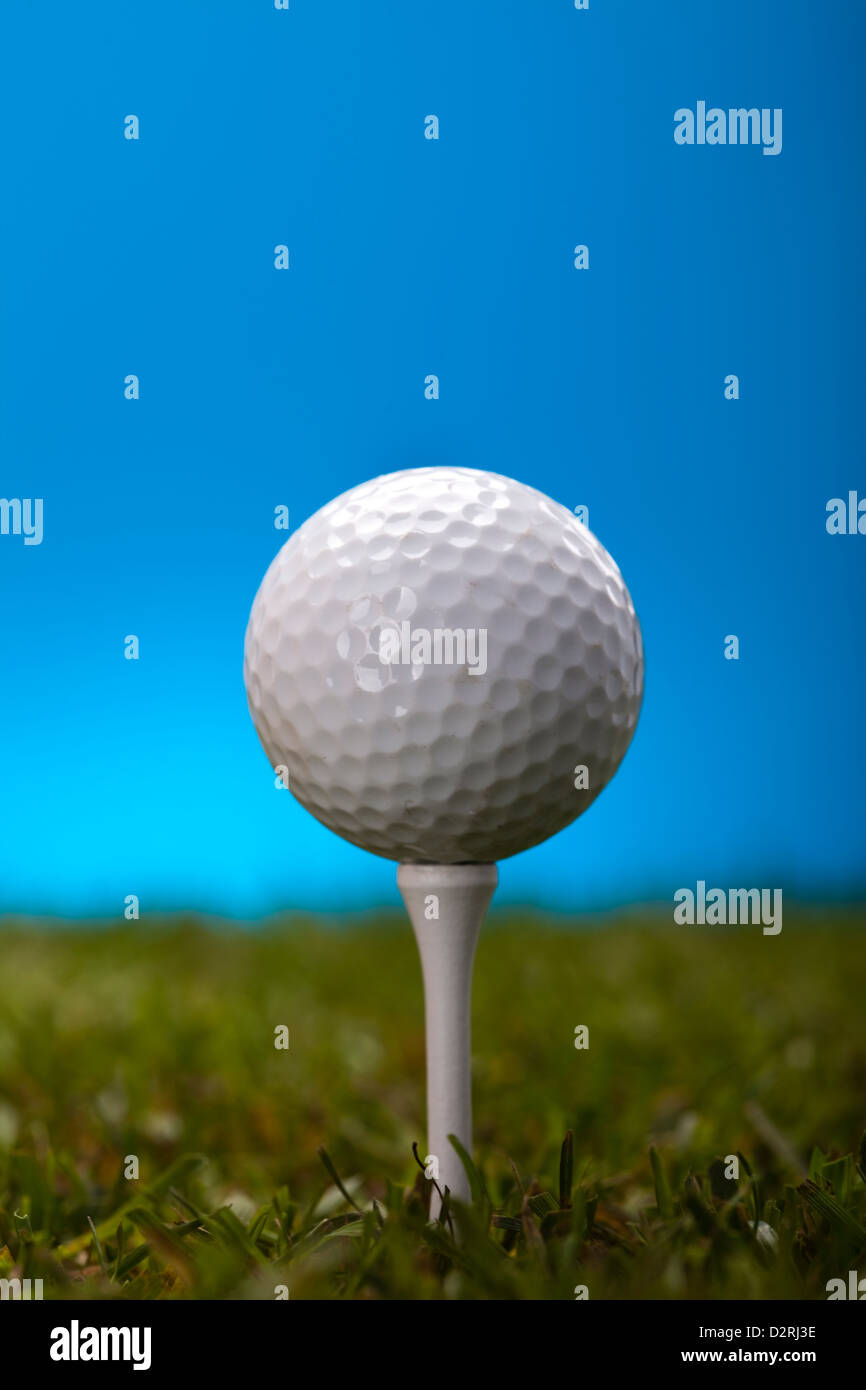 Golf ball on tee Stock Photo - Alamy