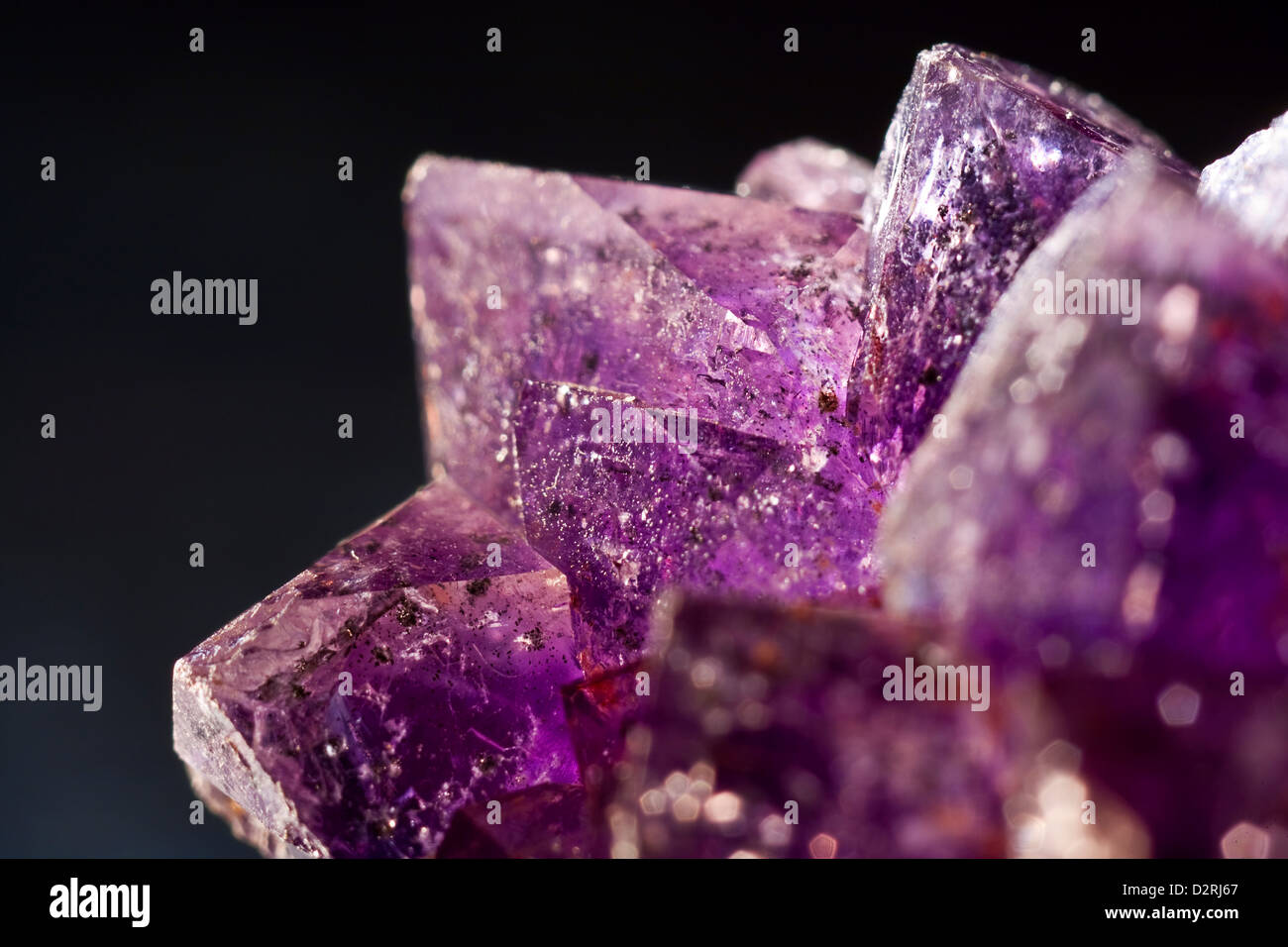 purple amethyst side over black background Stock Photo - Alamy