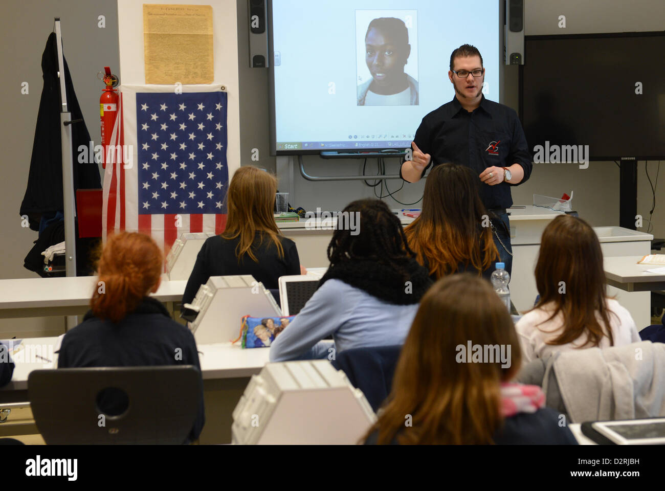 Teacher Benjamin Seelisch (C, back) holds in a classroom of the 7b ...