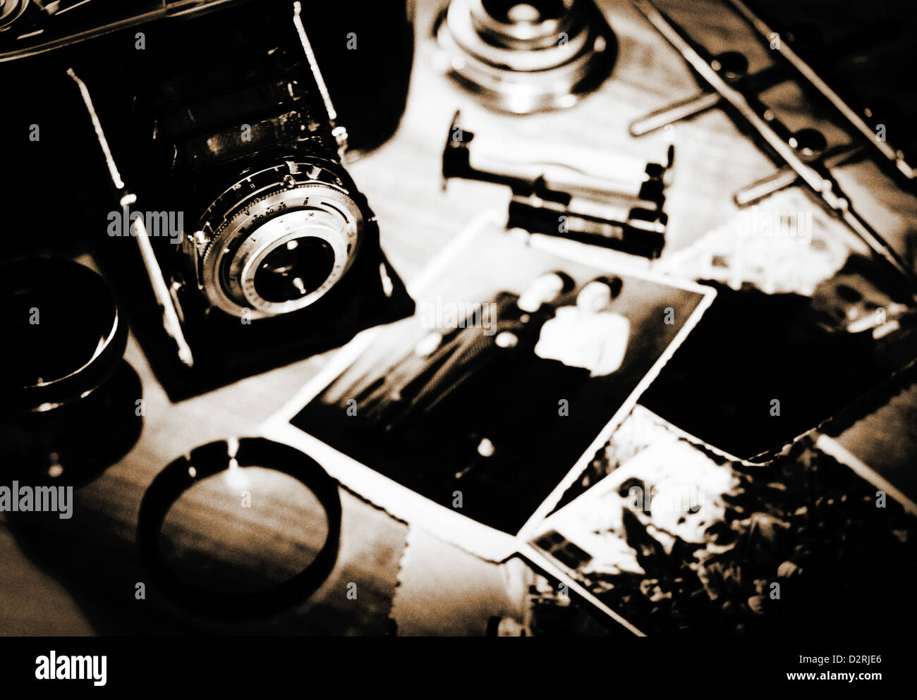 Vintage still life with retro photo camera and old photos Stock Photo ...