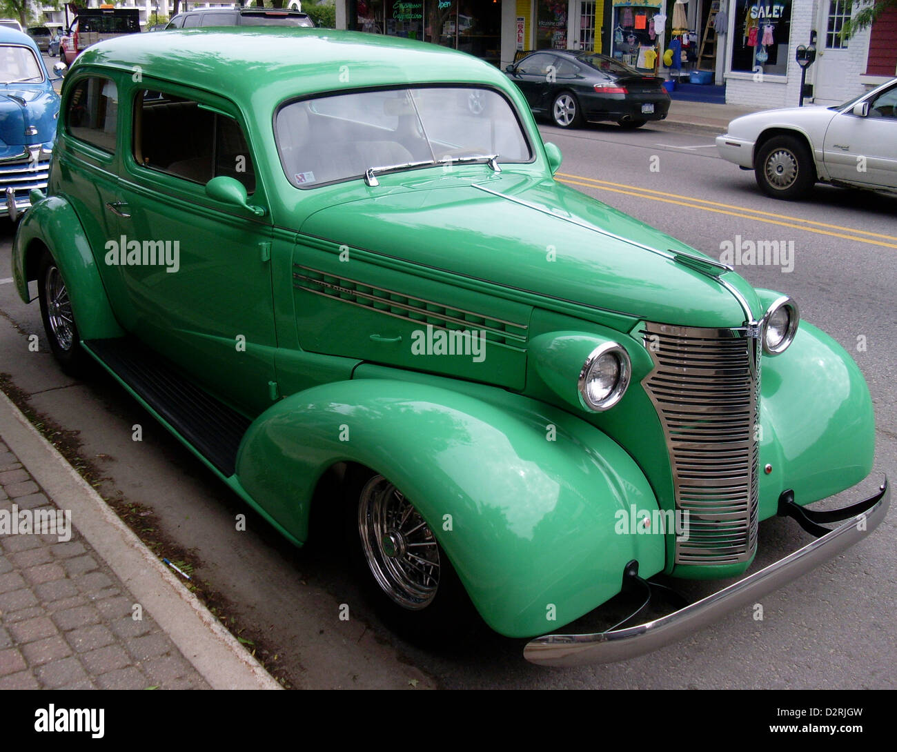 Green,classic American car parked by the road Stock Photo - Alamy