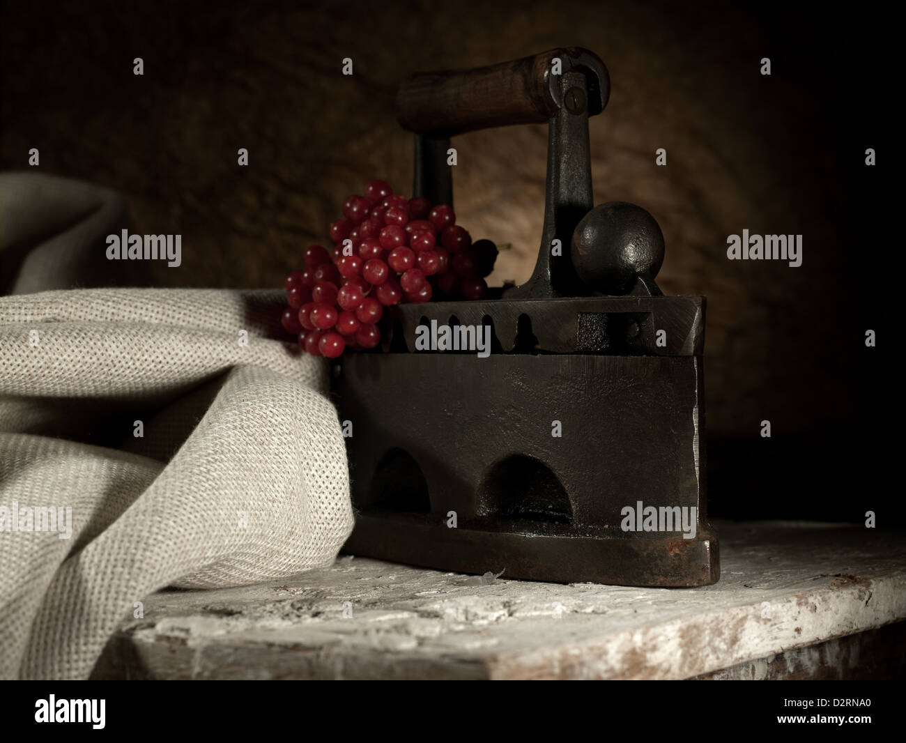 Retro still life with old rusty iron and textile Stock Photo - Alamy