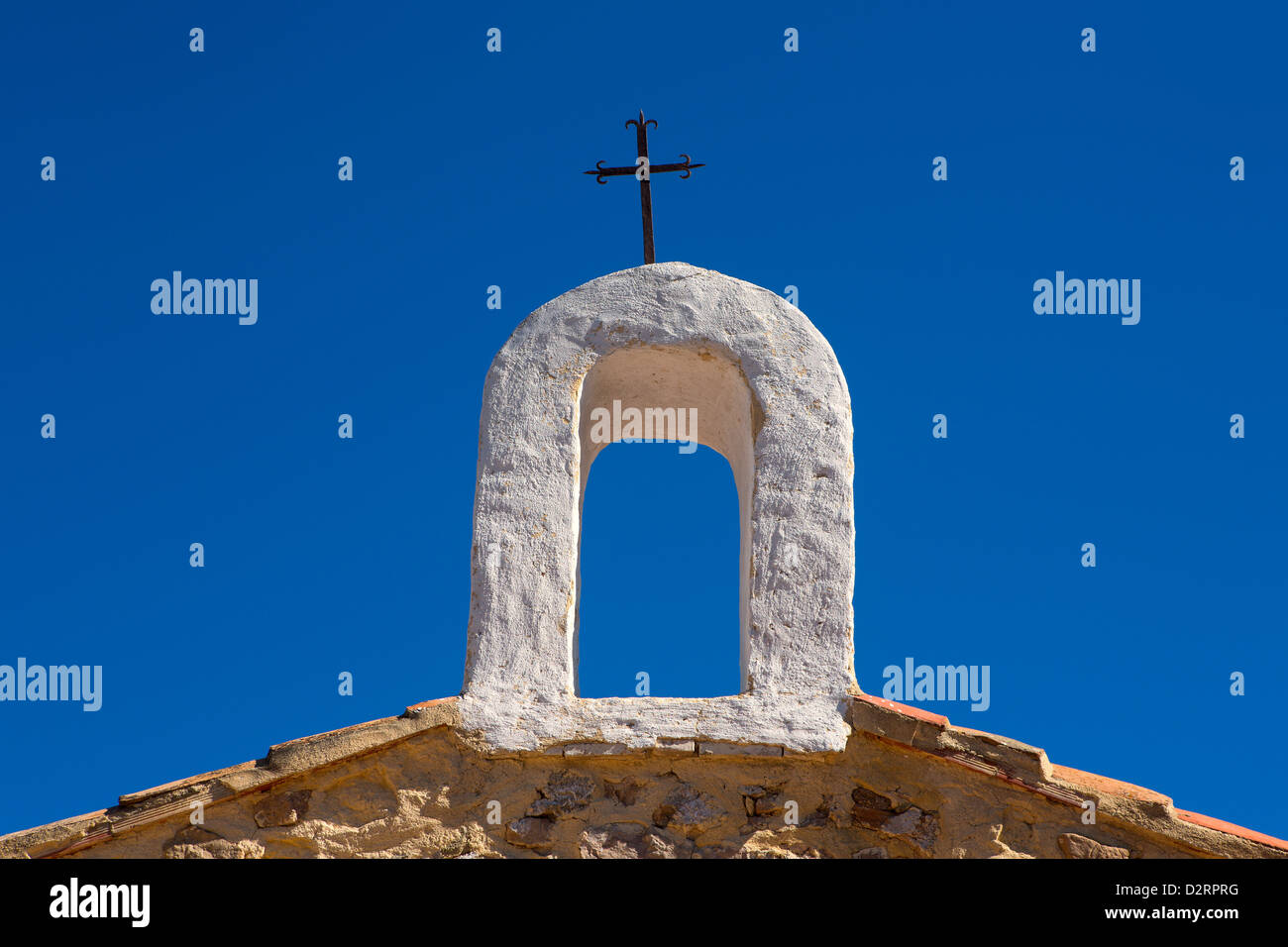 Christian cross on whitewashed arch at village church in Cuenca Spain ...
