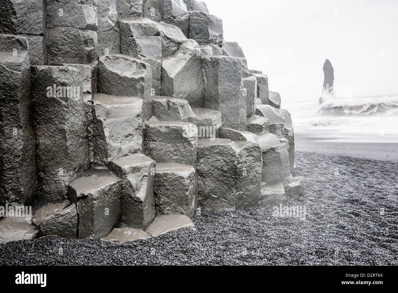 foot of basalt steps with ocean and protruding rock in background Stock ...