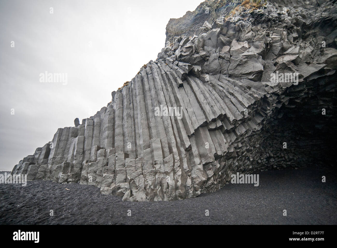 diagonal shot of basalt cave in iceland on a wet rainy winter day Stock ...