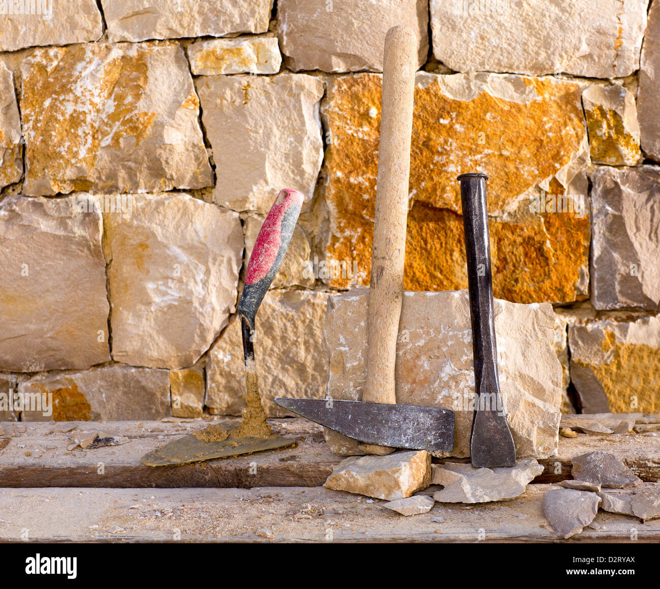 Hammer mason tools of stonecutter masonry work in a contruction stone ...