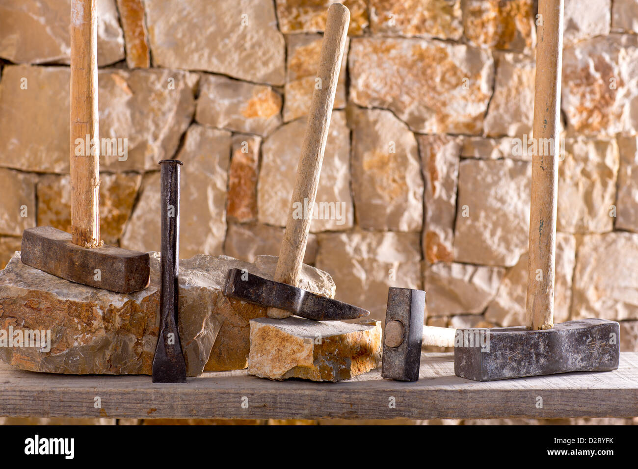 Hammer mason tools of stonecutter masonry work in a contruction stone ...