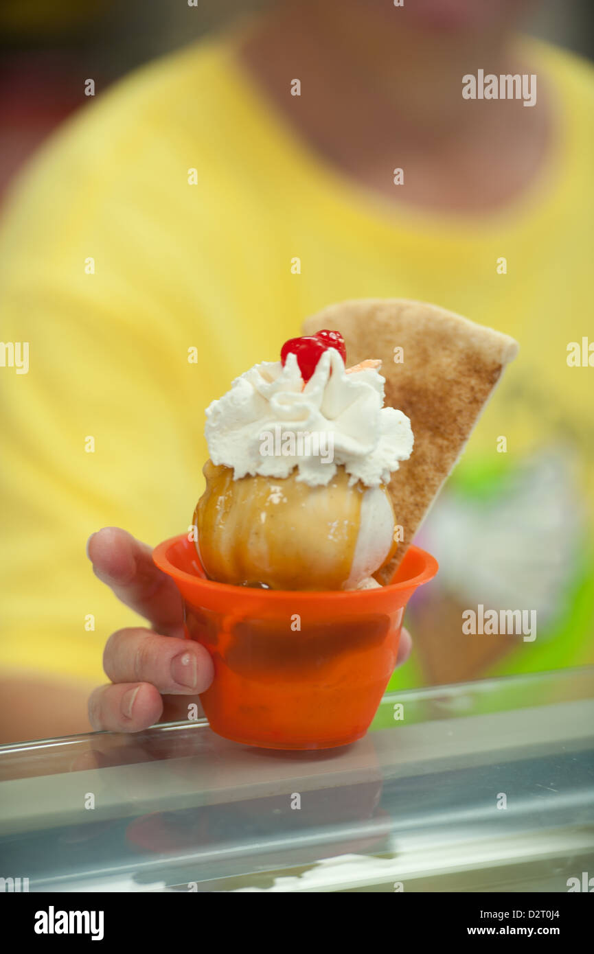 Woman serving an ice cream sundae Stock Photo - Alamy