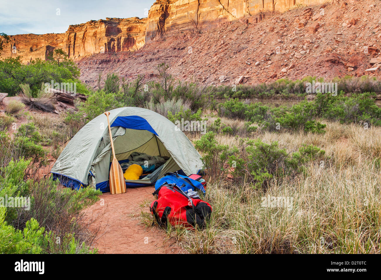 sunrise over river camping in Canyonlands National Park- a tent with ...