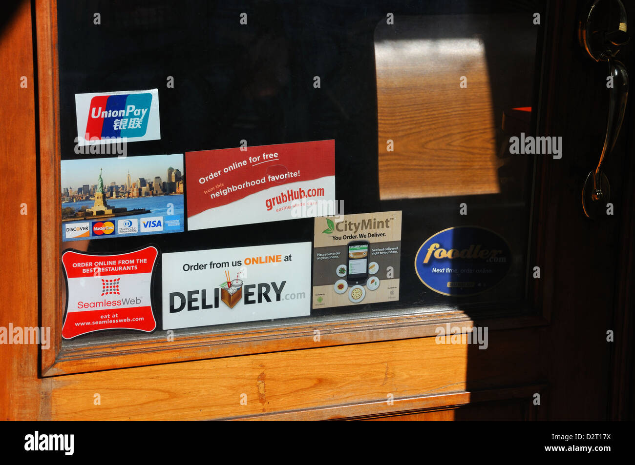 Stickers on store door Stock Photo - Alamy