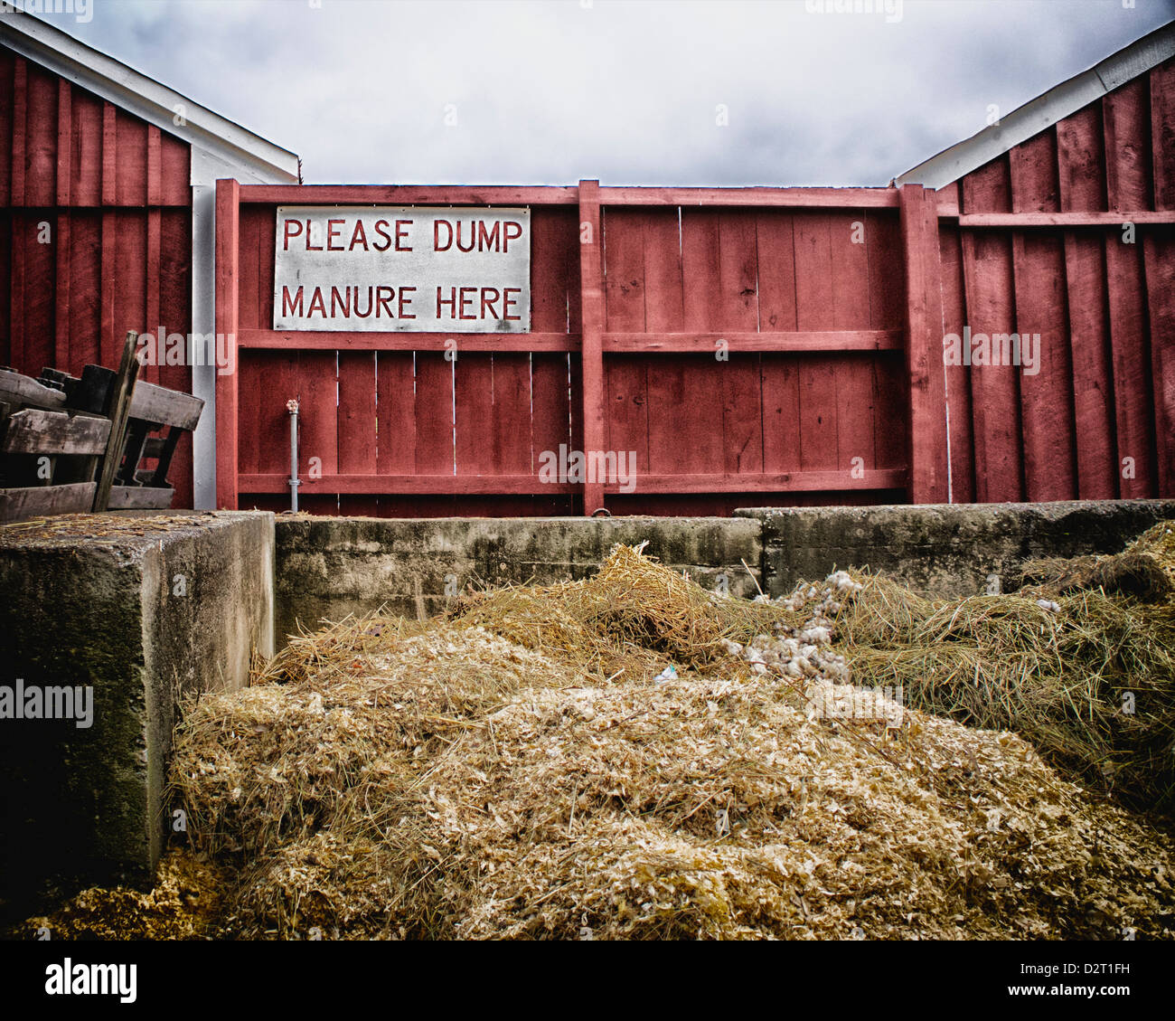 Humorous Image with sign Please Dump Manure Here Stock Photo - Alamy